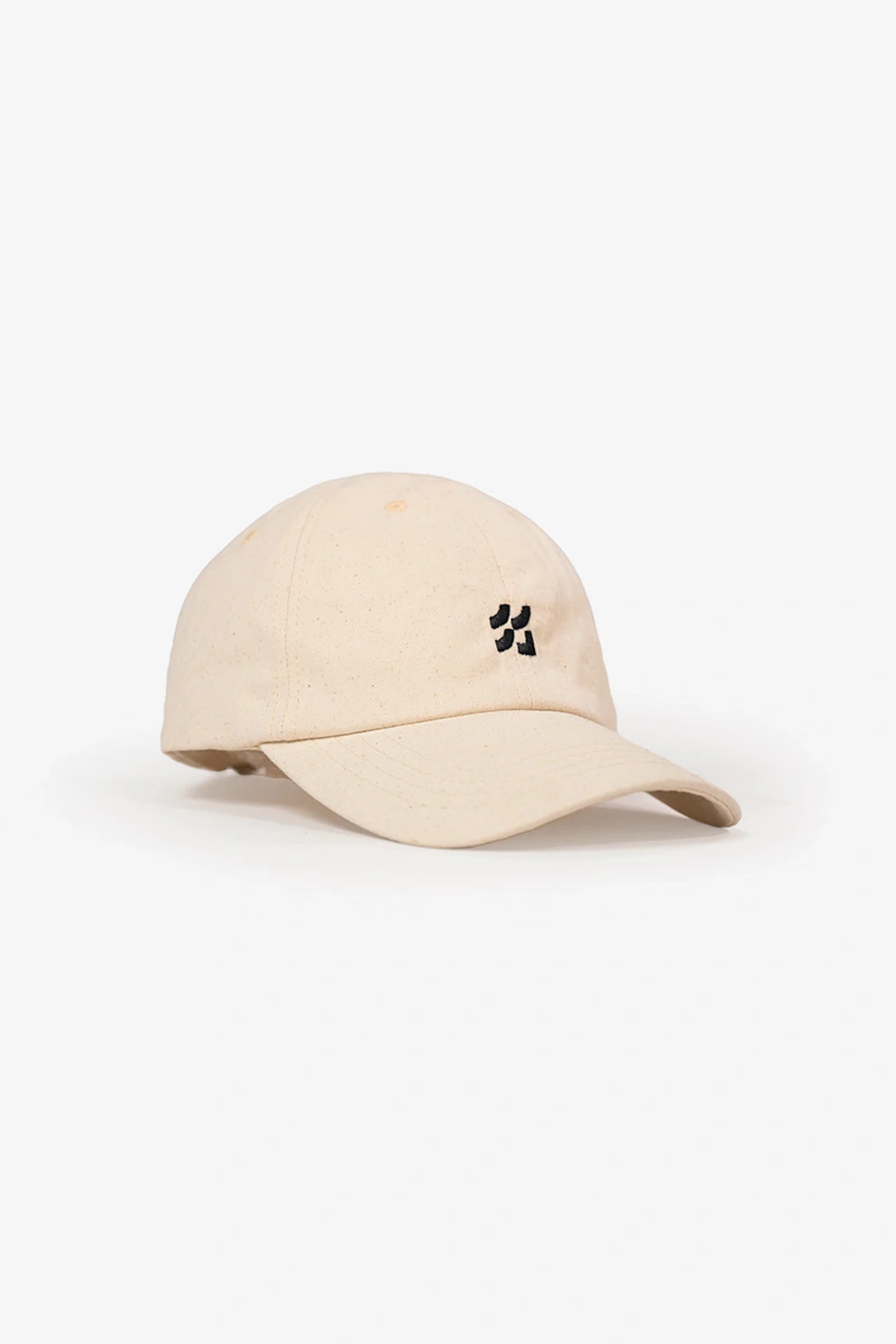 Custom branded beige dad cap for Conmedia merch | Sugarcoat