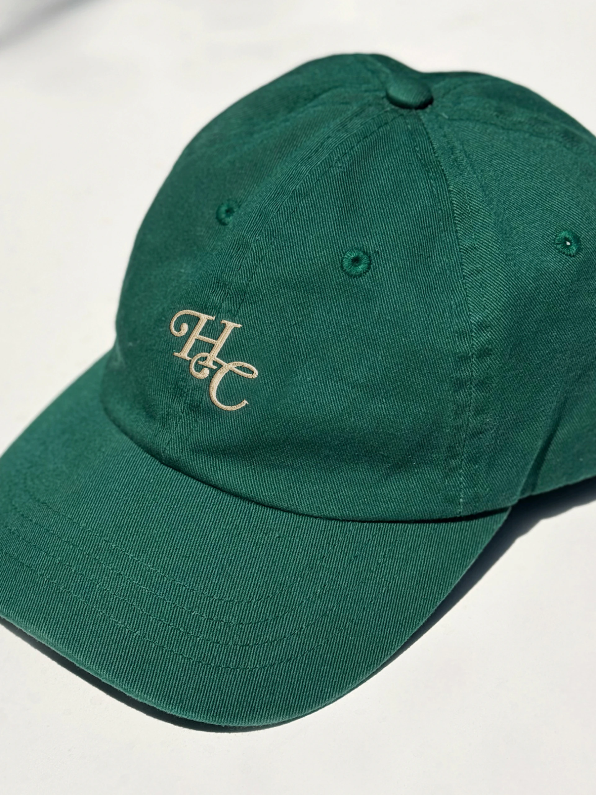 HolaCamp custom branded caps for company merchandise