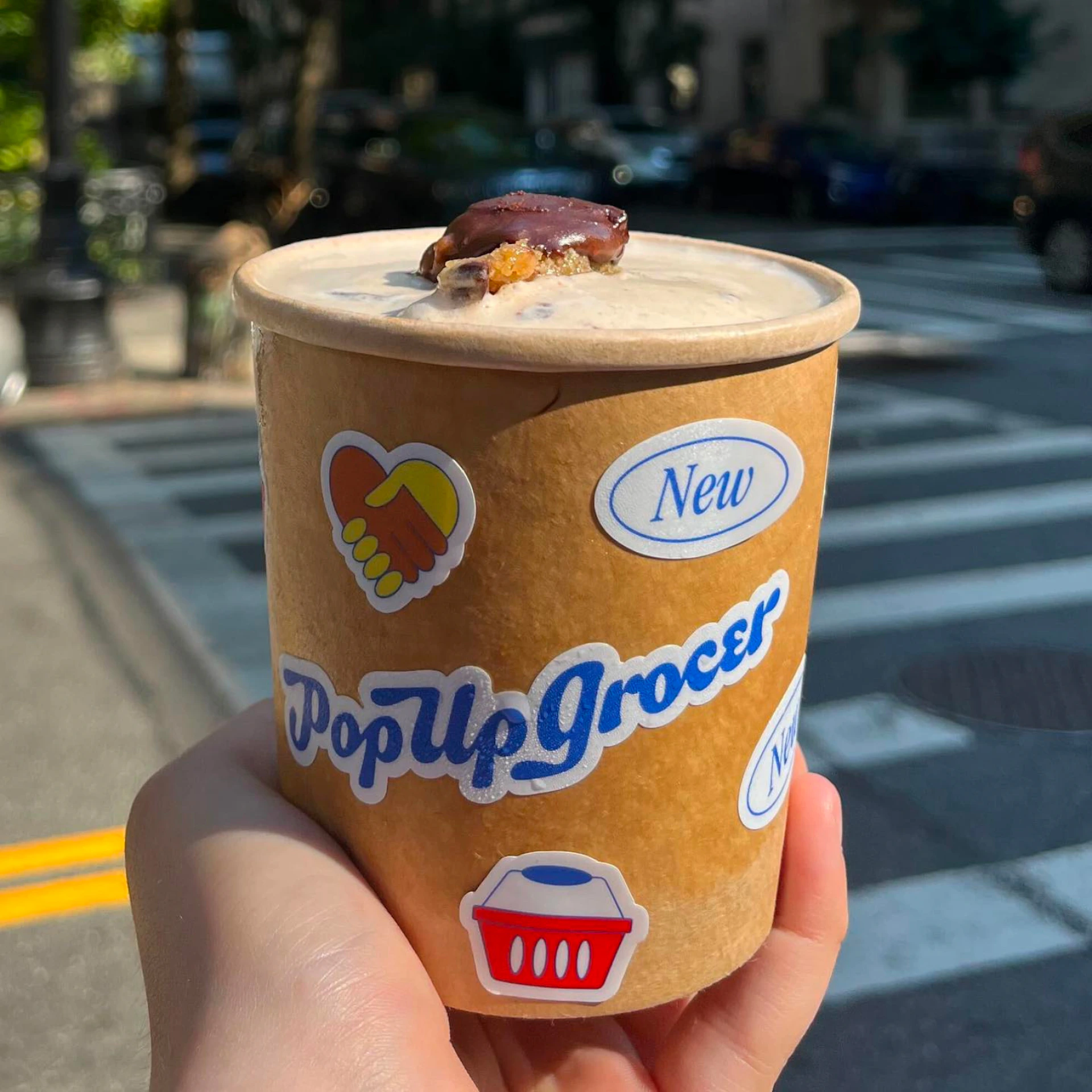 Pop Up Grocer's custom branded stickers for merch